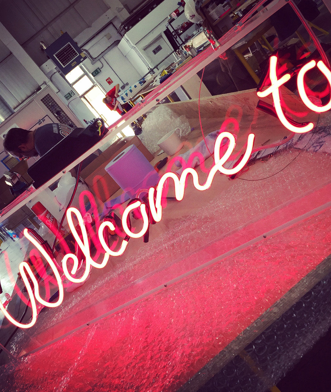 Neon Script Sign on clear acrylic